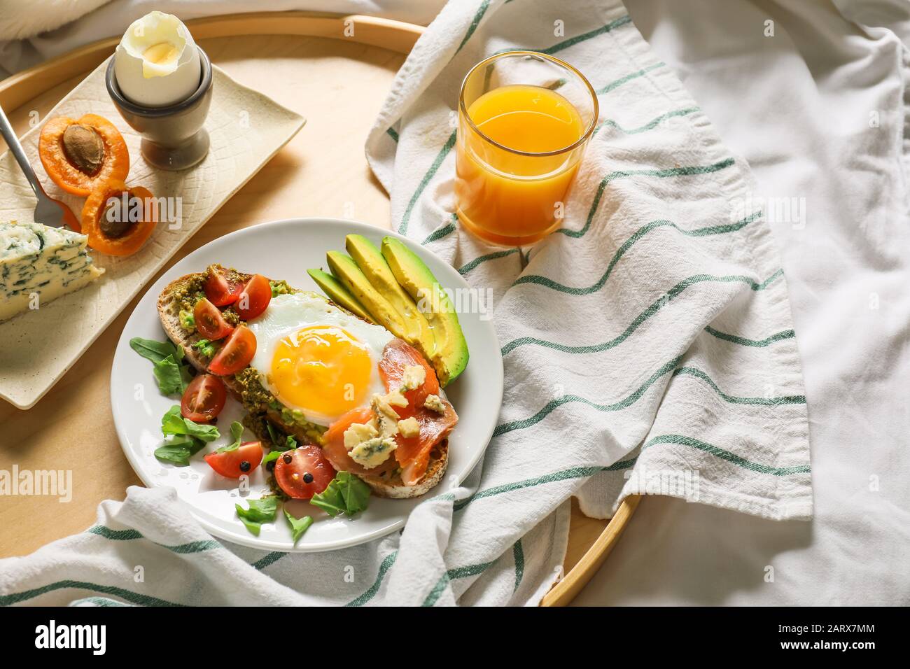 Tray with tasty breakfast on bed Stock Photo - Alamy