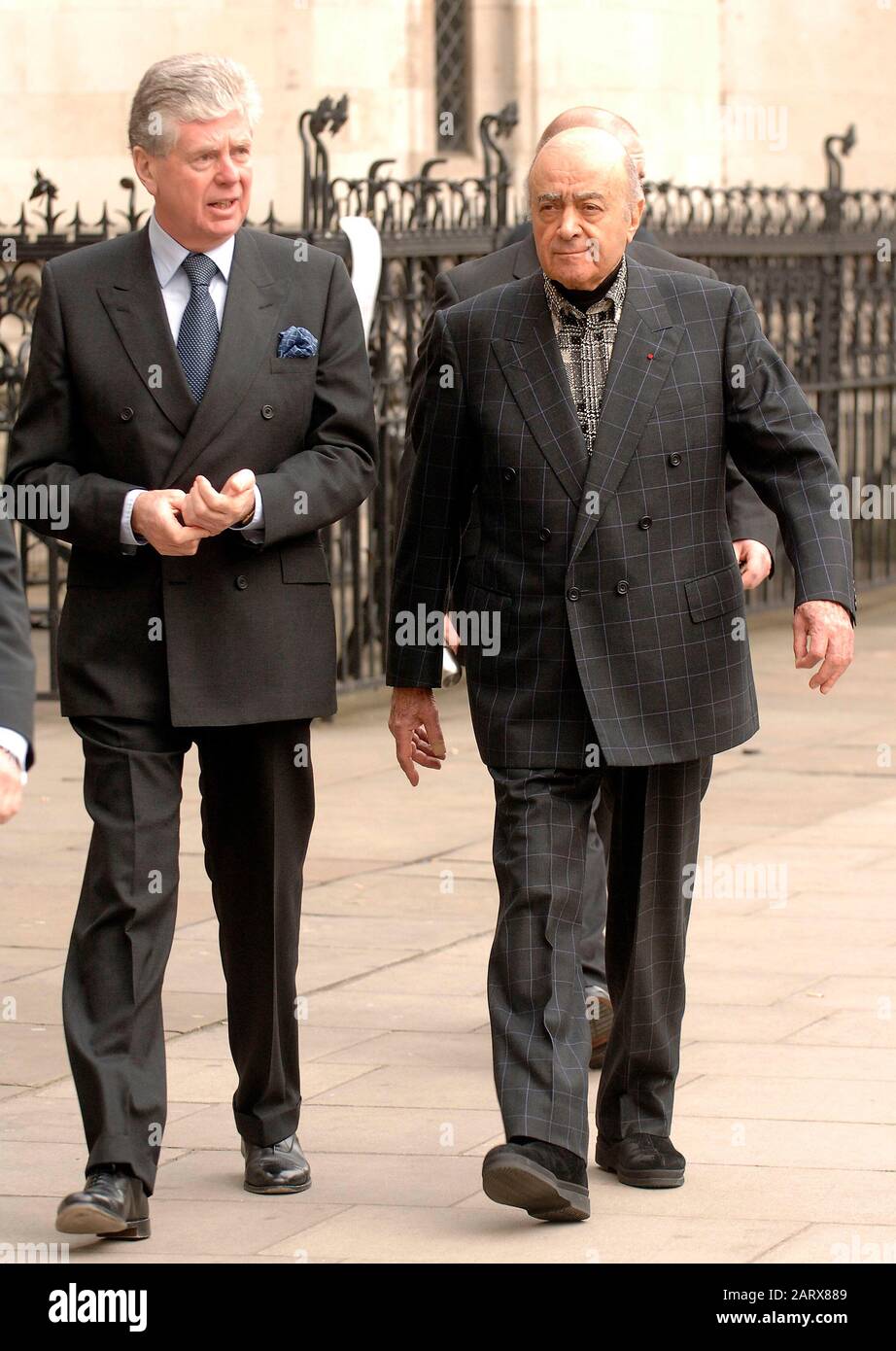 Mohamed Al Fayed and spokesperson Michael Cole arriving at the High ...