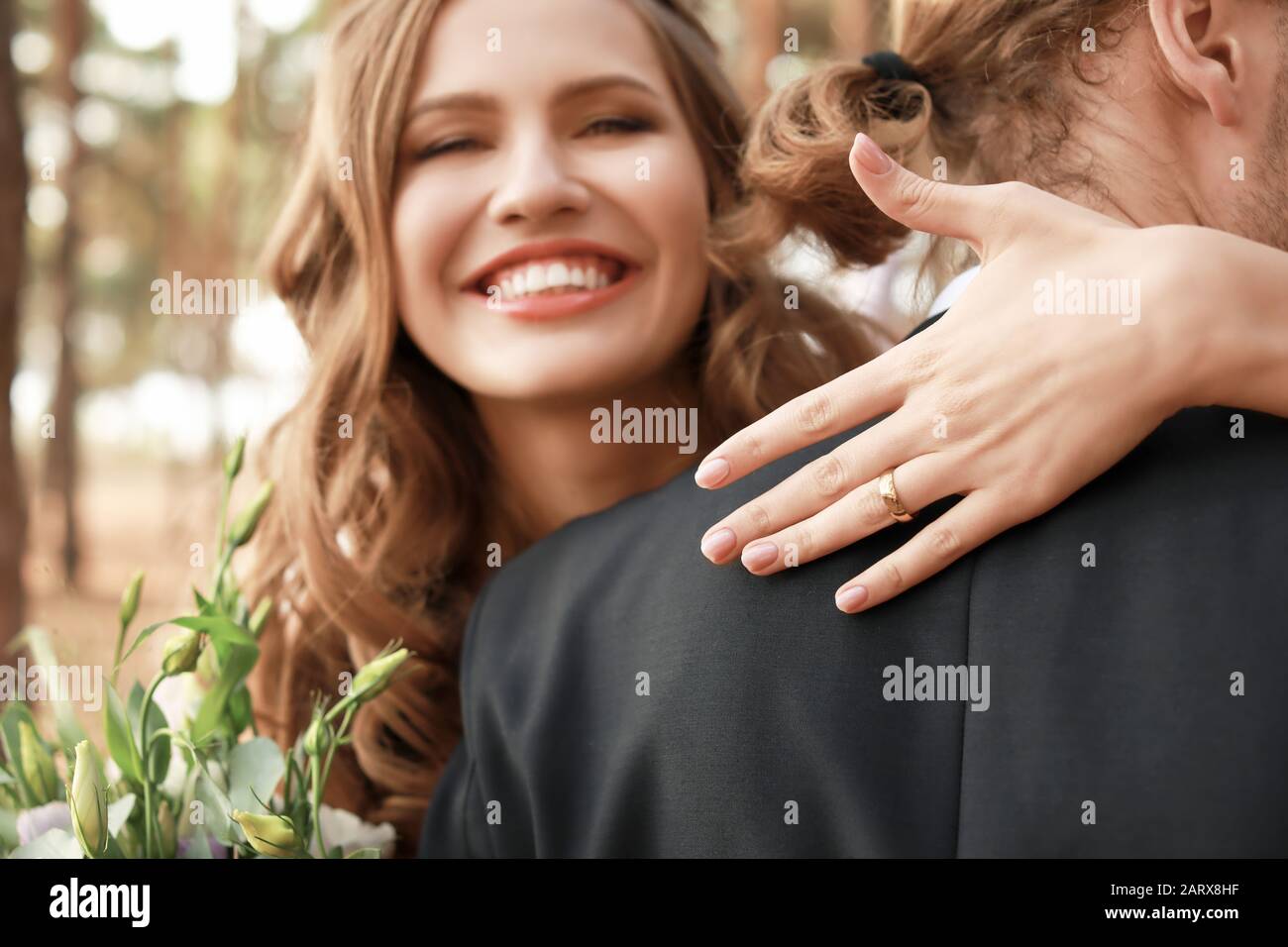 Happy couple celebrating their wedding outdoors Stock Photo - Alamy