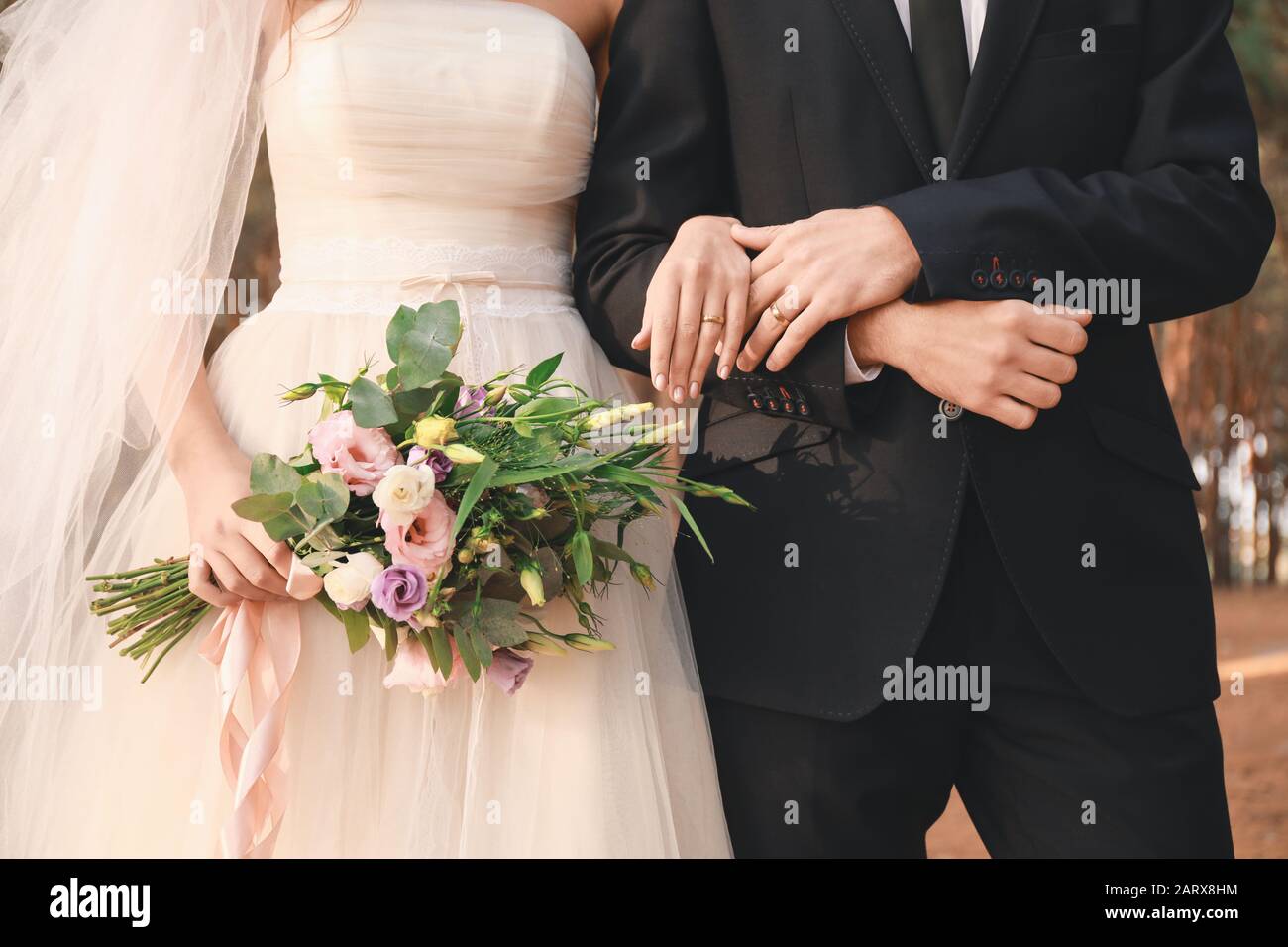 Happy couple celebrating their wedding outdoors Stock Photo - Alamy