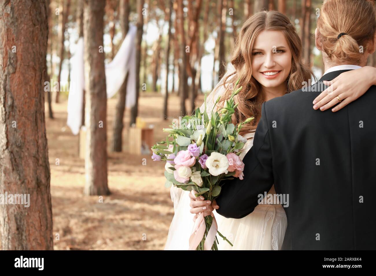 Happy couple celebrating their wedding outdoors Stock Photo - Alamy