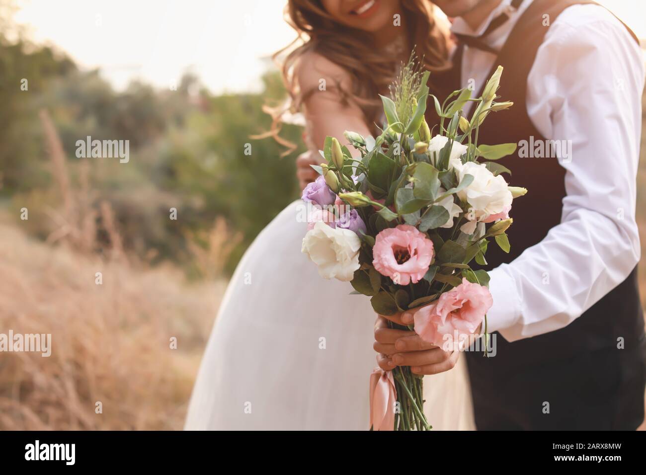 Happy couple celebrating their wedding outdoors Stock Photo - Alamy