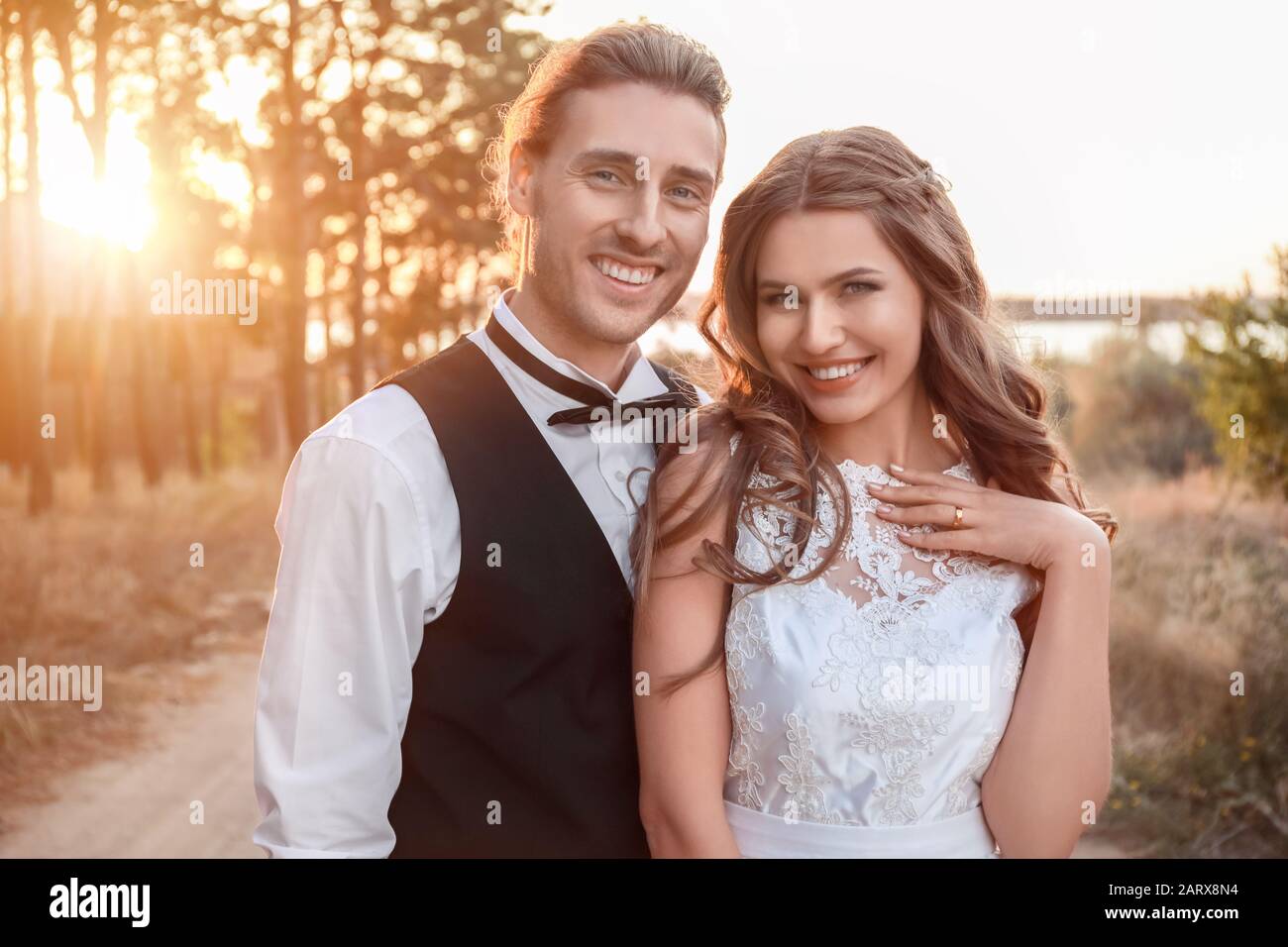 Happy couple celebrating their wedding outdoors Stock Photo - Alamy