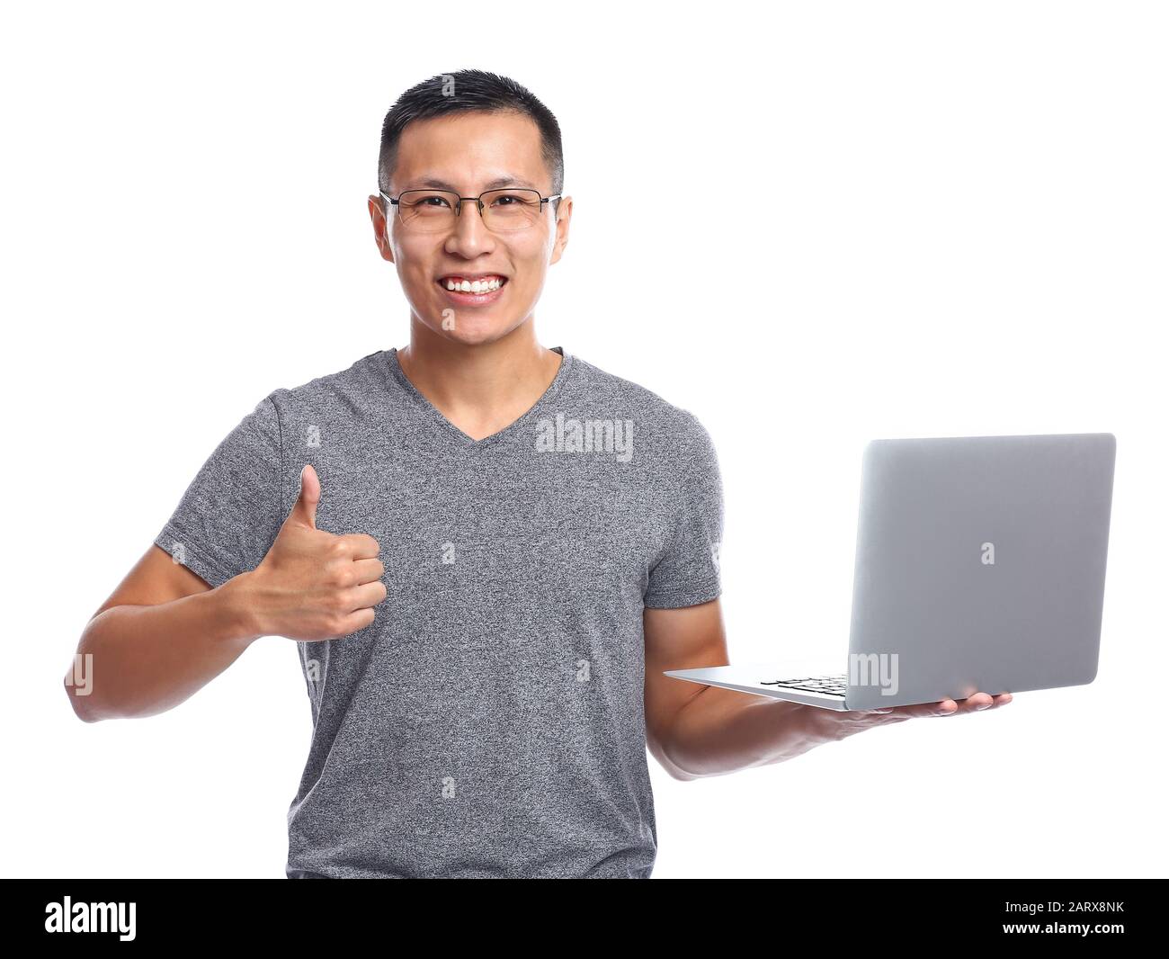 Male Asian programmer with laptop showing thumb-up on white background Stock Photo - Alamy