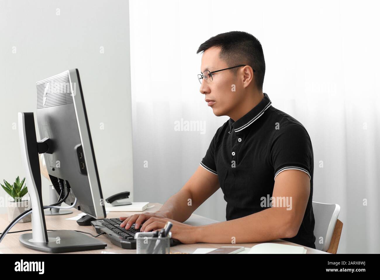 Young asian programmer working hi-res stock photography and images - Alamy