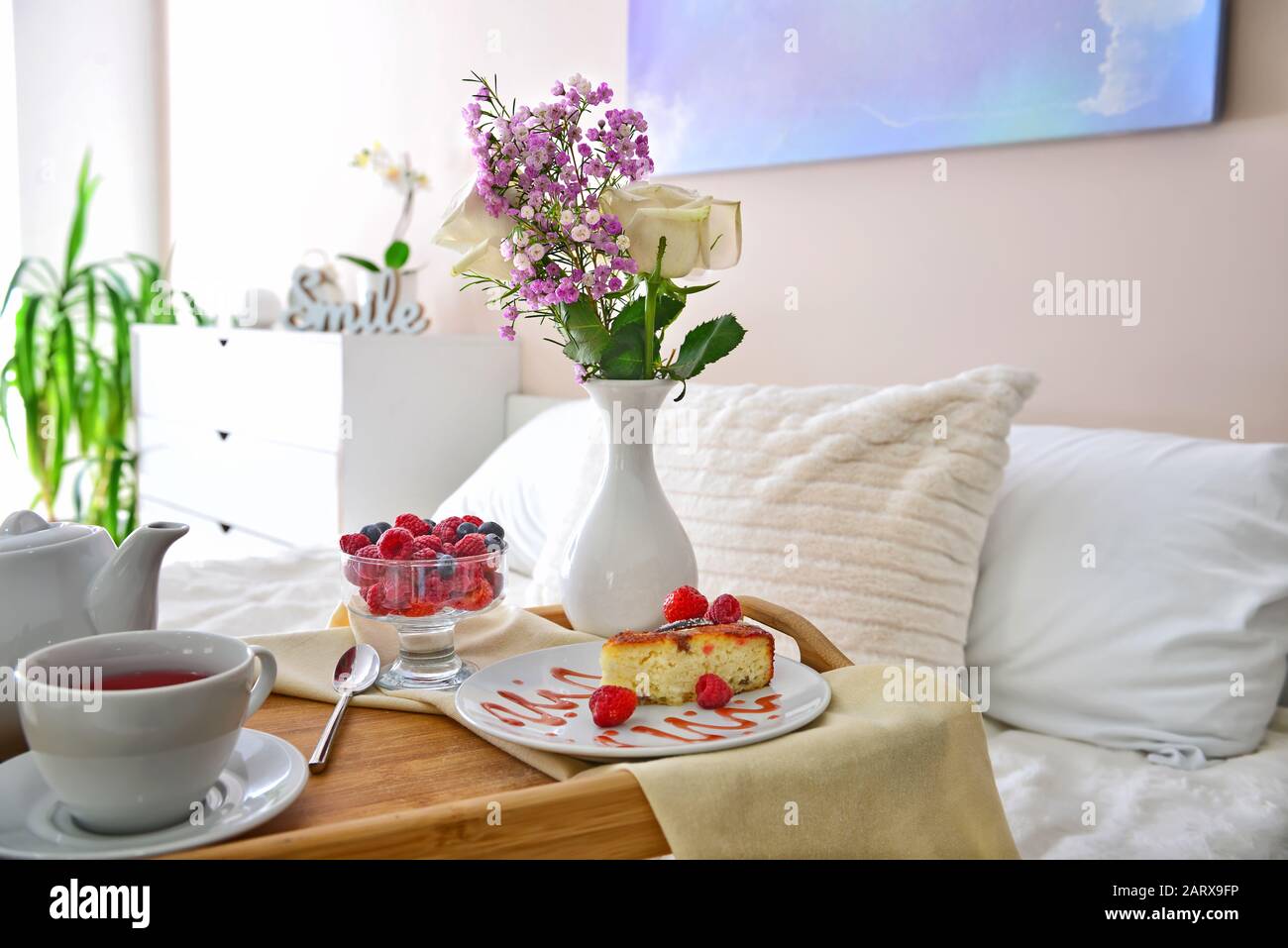 Tray table with tasty breakfast on bed Stock Photo - Alamy
