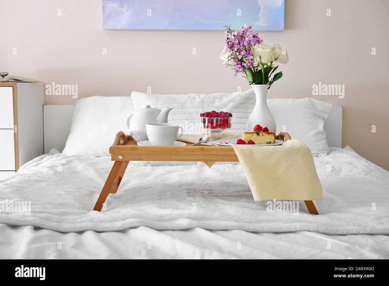 Tray table with tasty breakfast on bed Stock Photo - Alamy