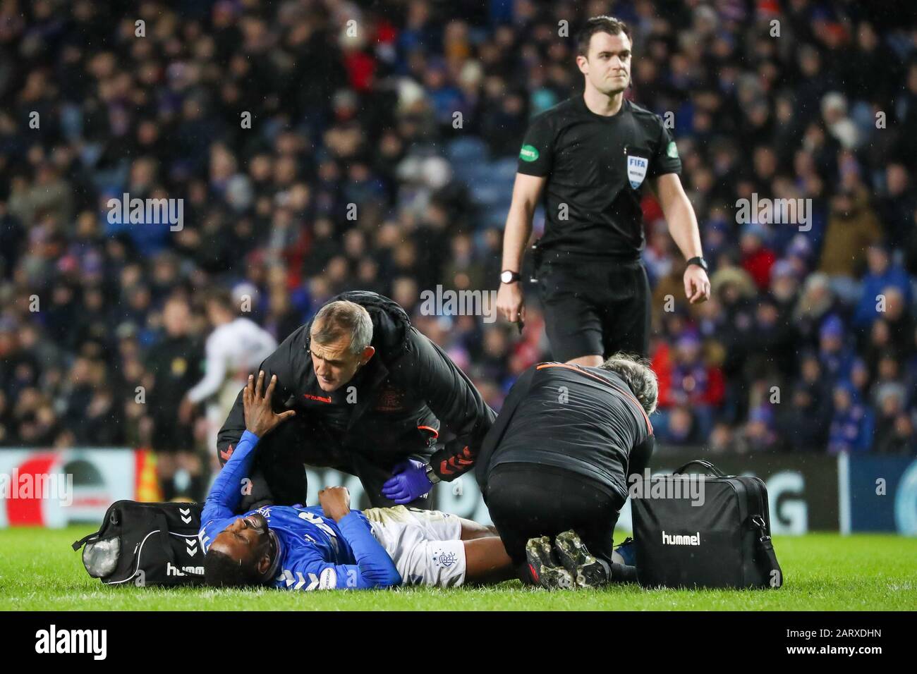 An injured player is carried off the pitch hi-res stock photography and ...