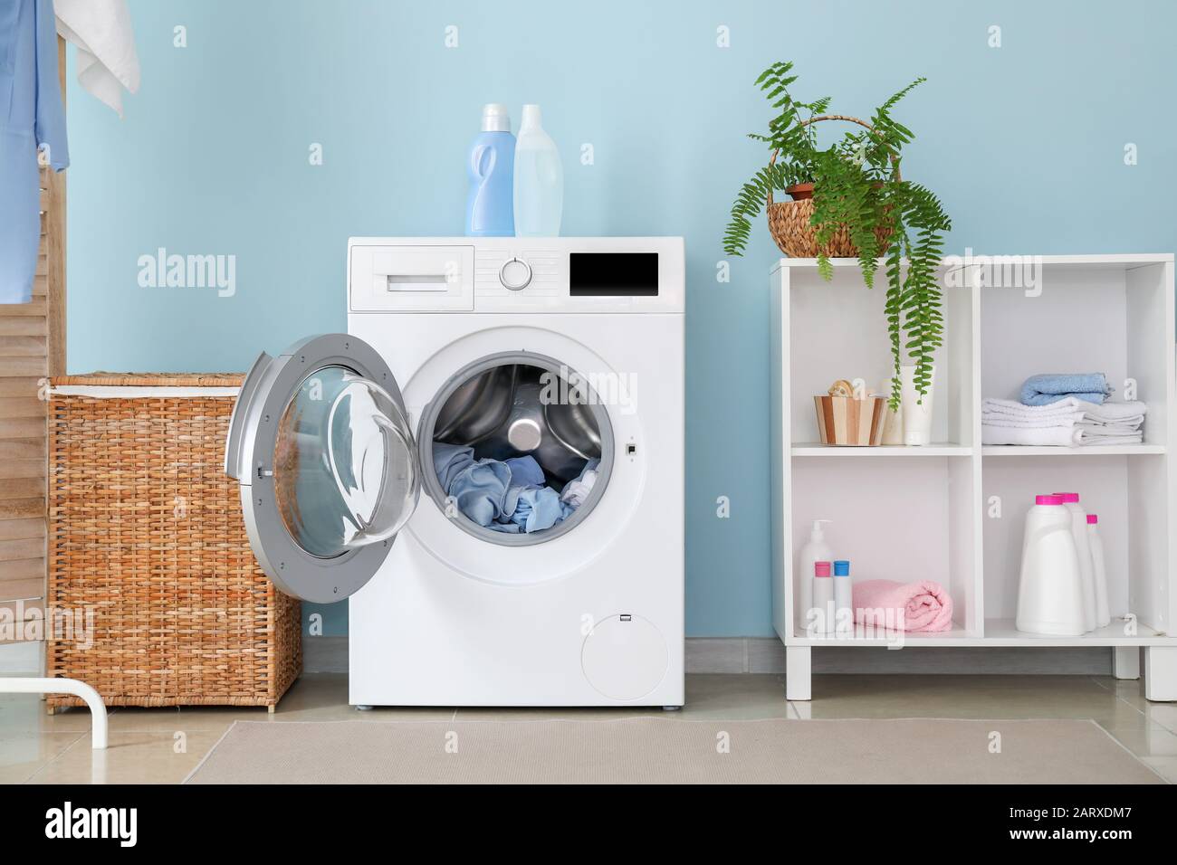 Interior of home laundry room with modern washing machine Stock Photo ...
