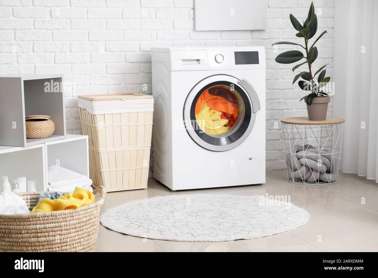 Interior of home laundry room with modern washing machine Stock Photo ...