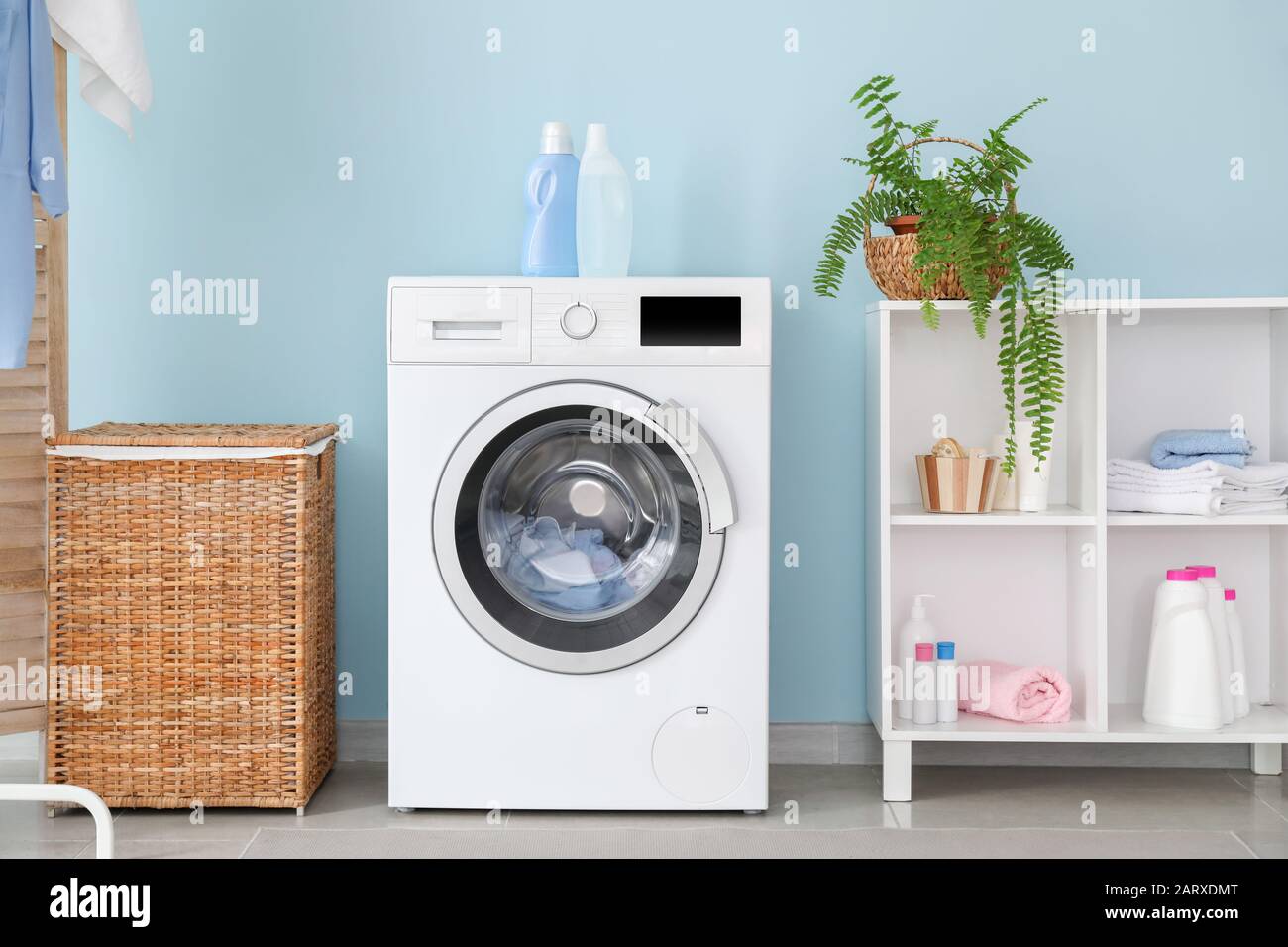 Interior of home laundry room with modern washing machine Stock Photo ...