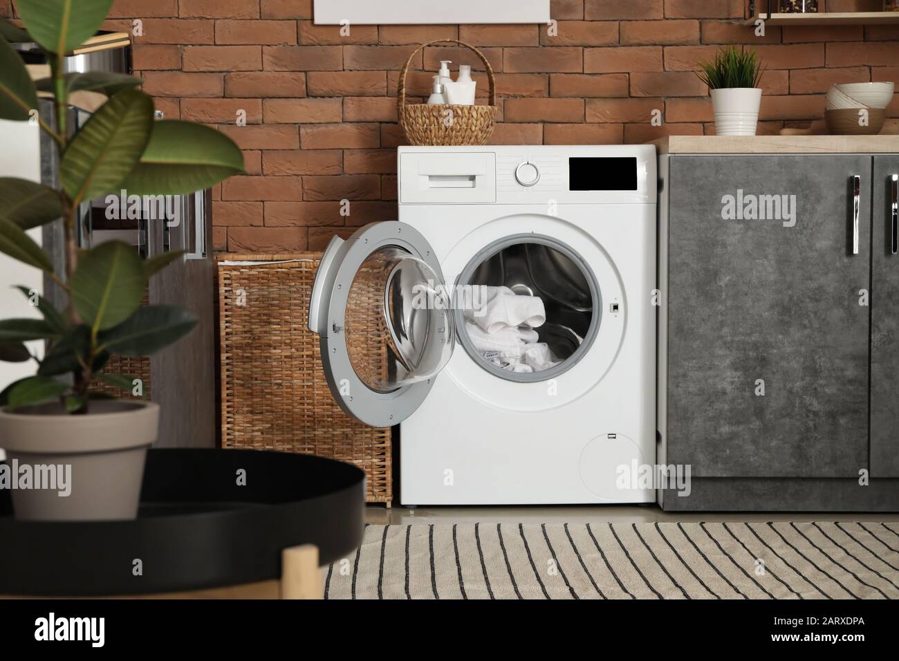 Interior of kitchen with modern washing machine Stock Photo - Alamy