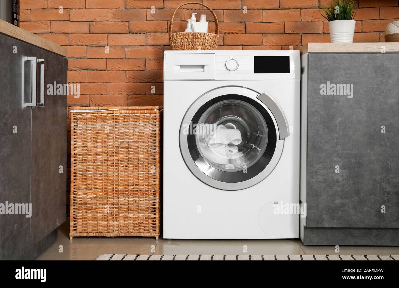 Interior of kitchen with modern washing machine Stock Photo - Alamy