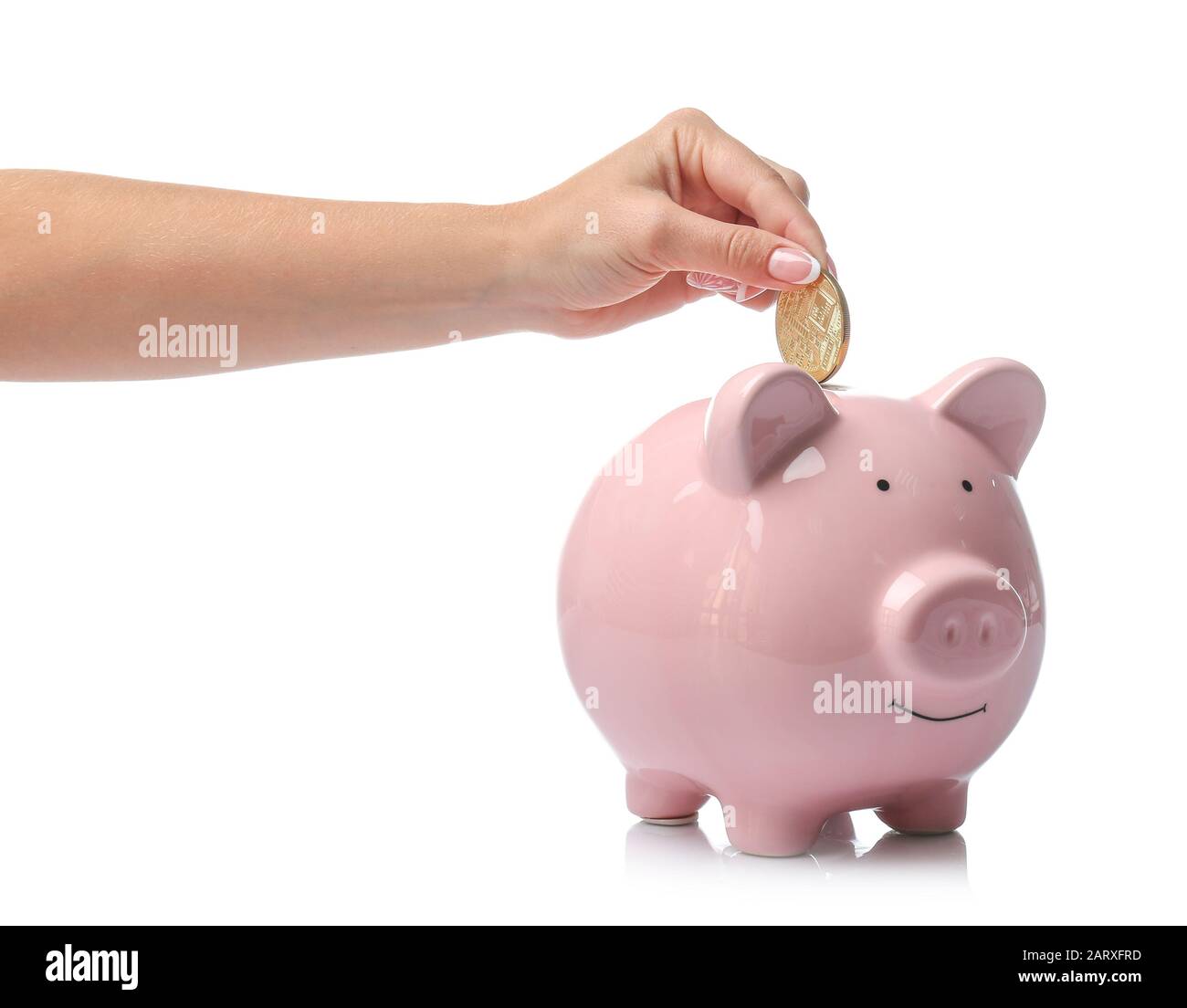 Hand with coin inserting savings Cut Out Stock Images & Pictures - Alamy