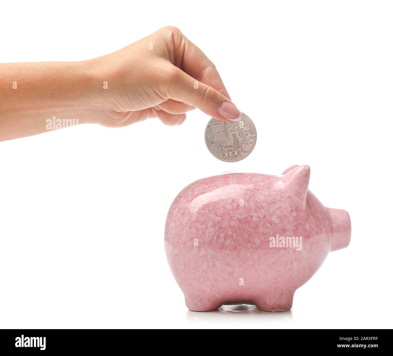 Hand with coin inserting savings Cut Out Stock Images & Pictures - Alamy