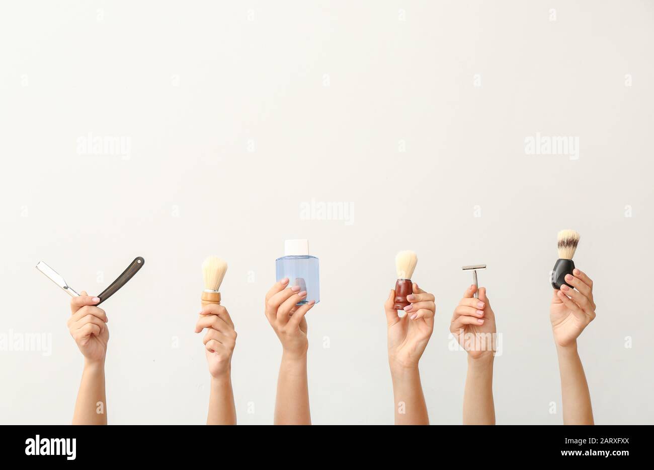 Hands with different tools for shaving on white background Stock Photo ...