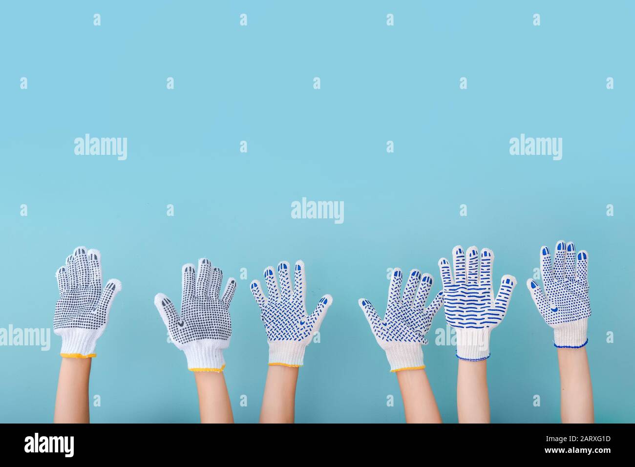 Hands in gloves painting hi-res stock photography and images - Alamy