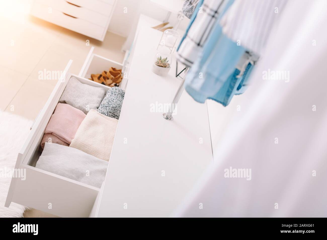 Drawers with clean clothes in dressing room Stock Photo - Alamy