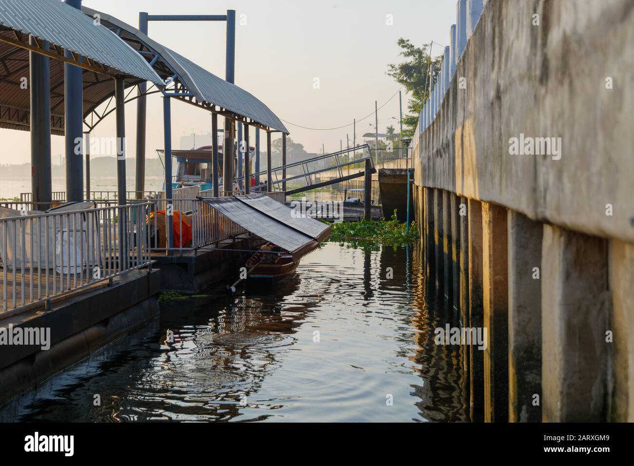 View between floating steel pontoon, pier or dock without people and ...