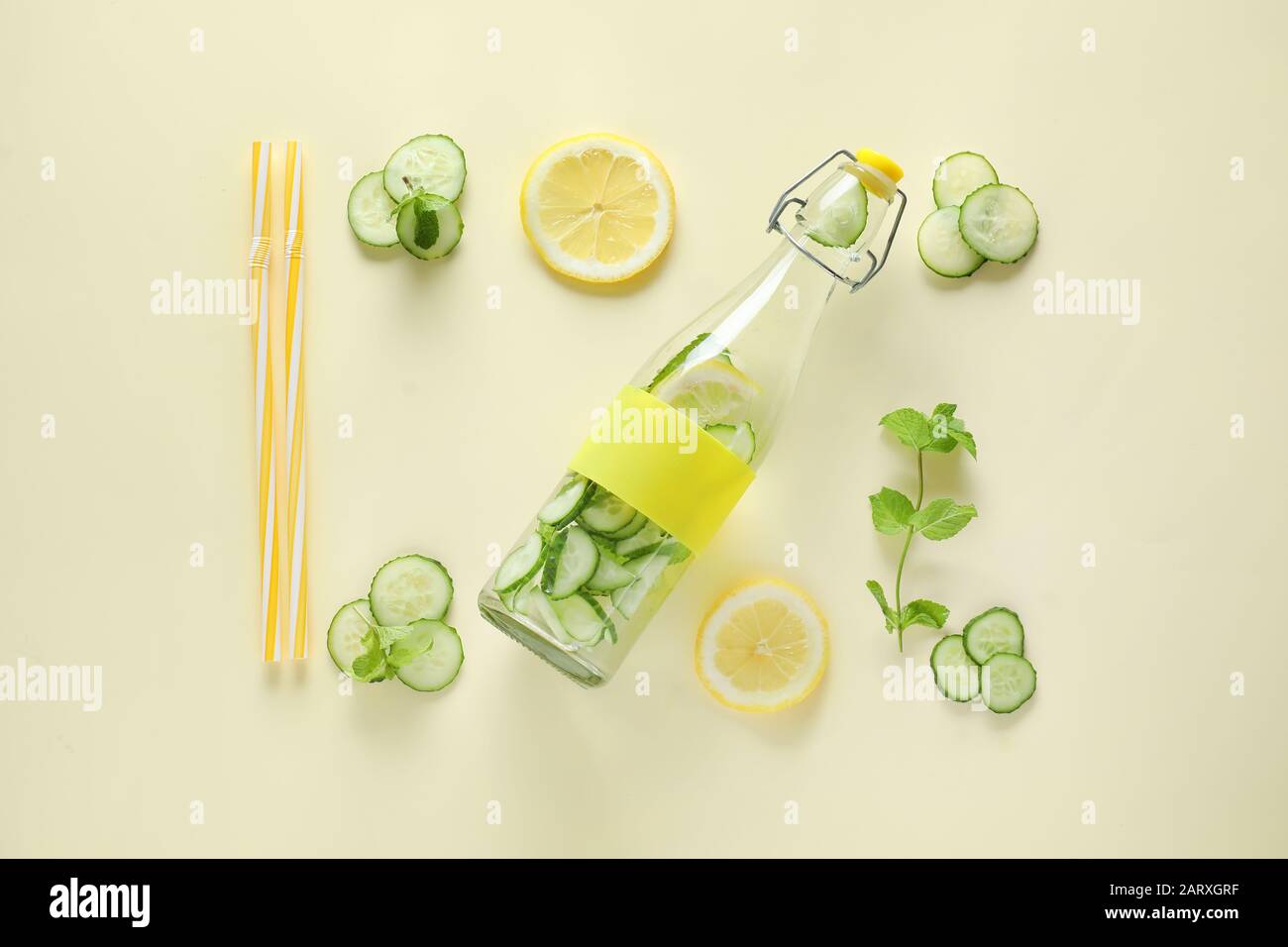 Bottle of healthy infused water with ingredients on light background ...