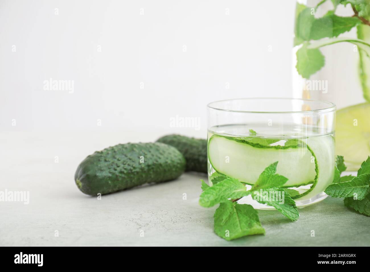 Glass of healthy infused water on light background Stock Photo - Alamy