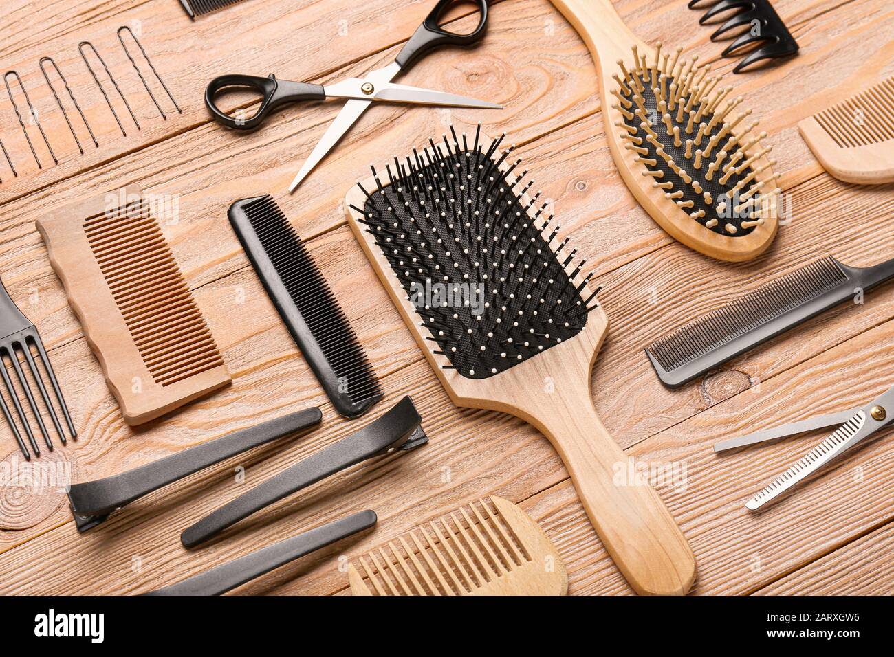 Set of hairdresser tools on wooden background Stock Photo - Alamy