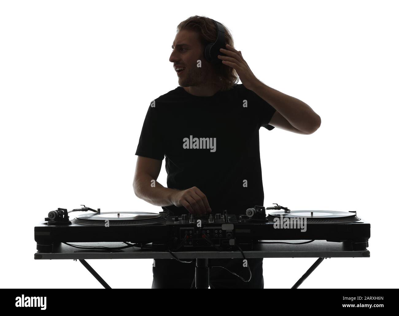 Silhouette of male dj playing music on white background Stock Photo - Alamy