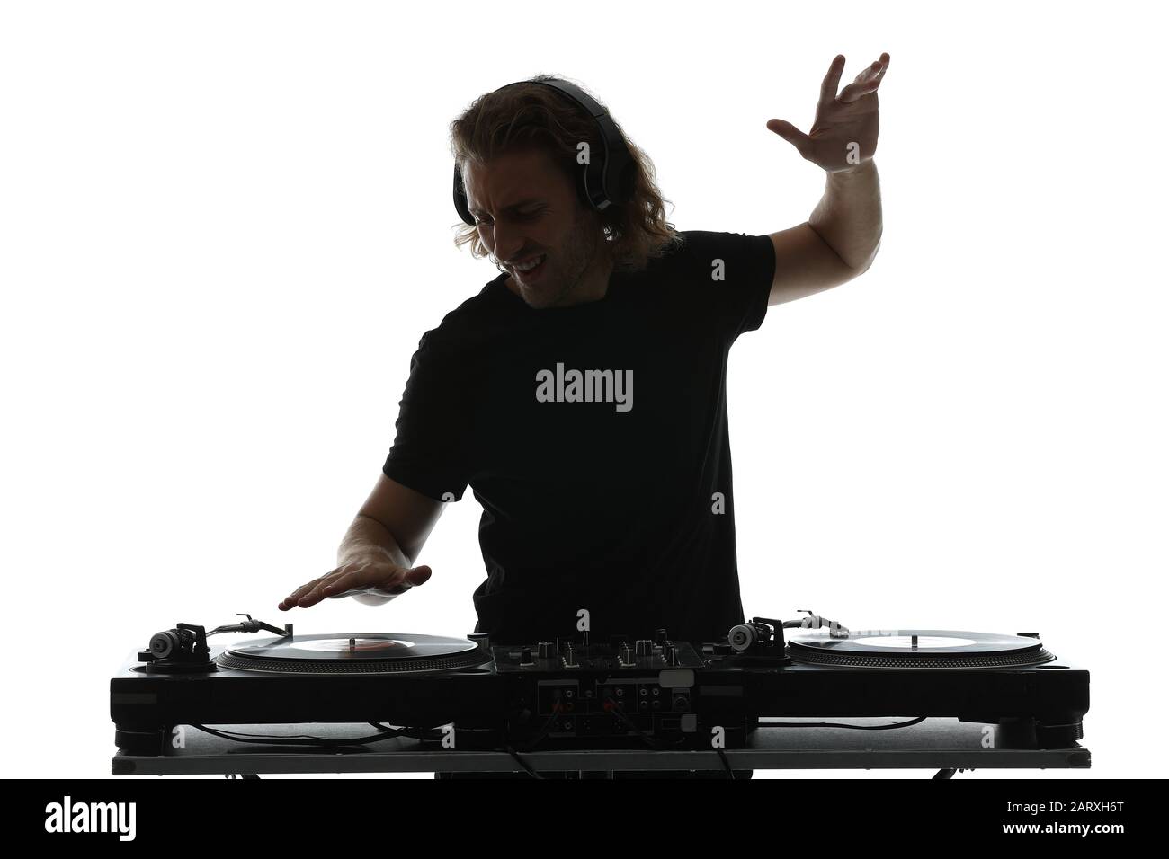 Silhouette of male dj playing music on white background Stock Photo - Alamy