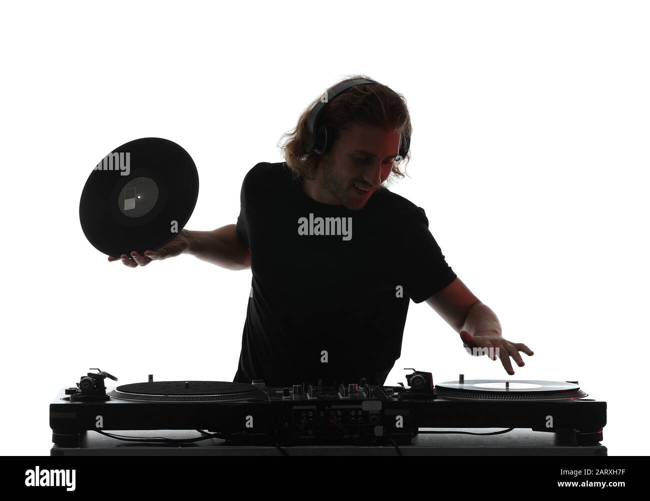 Silhouette of male dj playing music on white background Stock Photo - Alamy