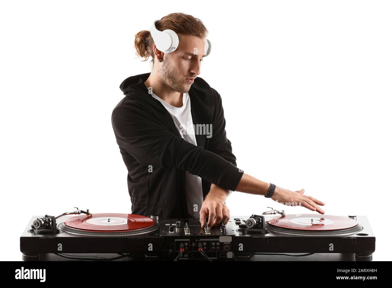 Male dj playing music on white background Stock Photo - Alamy