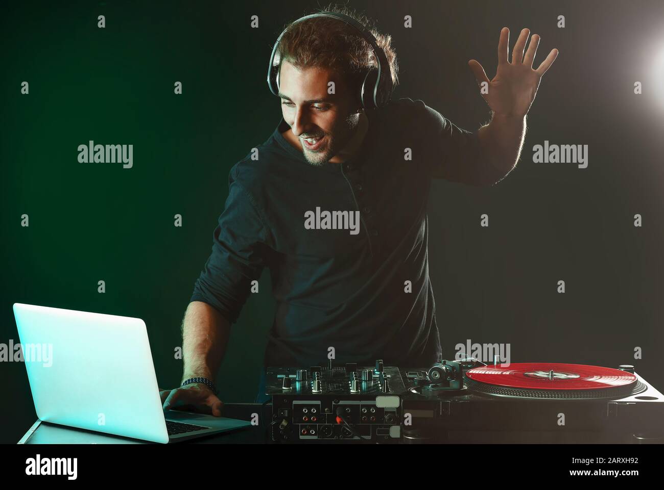 Male dj playing music in nightclub Stock Photo - Alamy