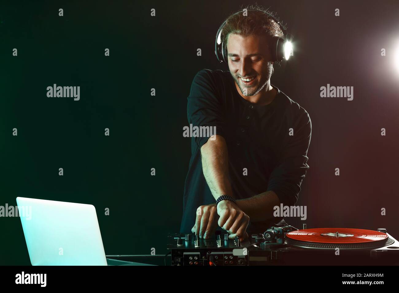Male dj playing music in nightclub Stock Photo - Alamy