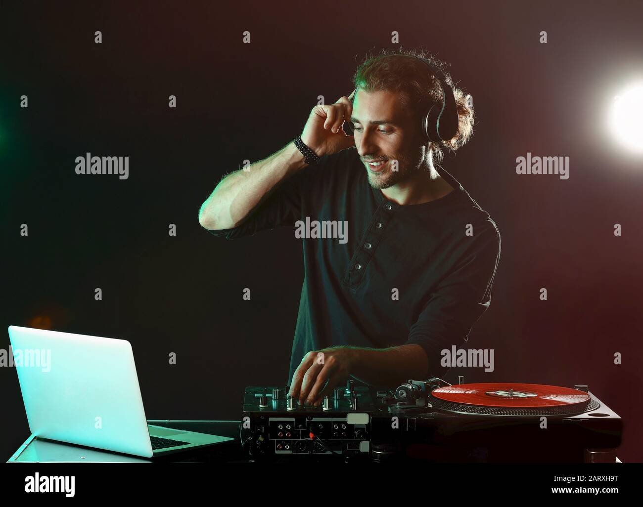Male dj playing music in nightclub Stock Photo - Alamy