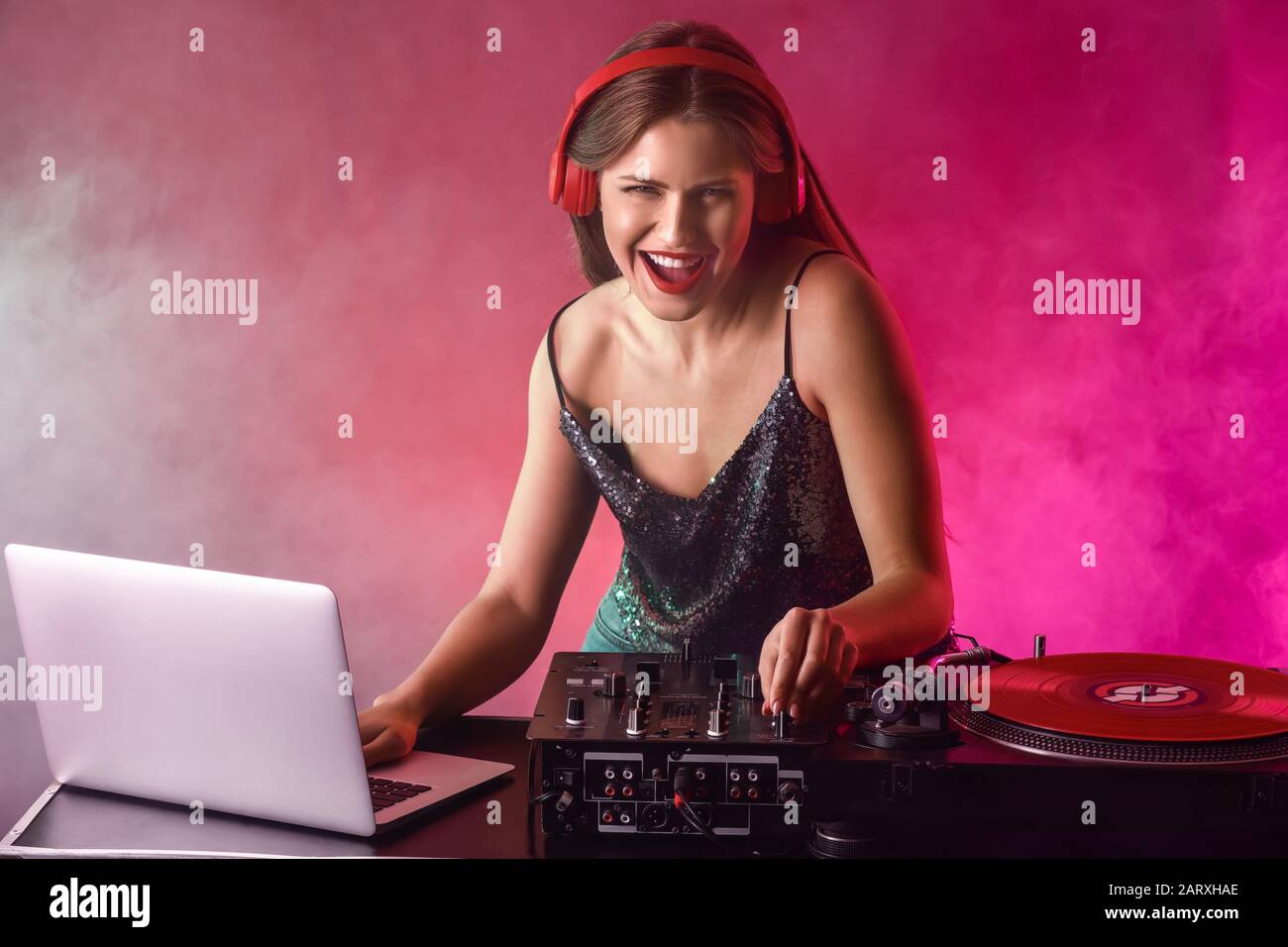 Female dj playing music in nightclub Stock Photo - Alamy
