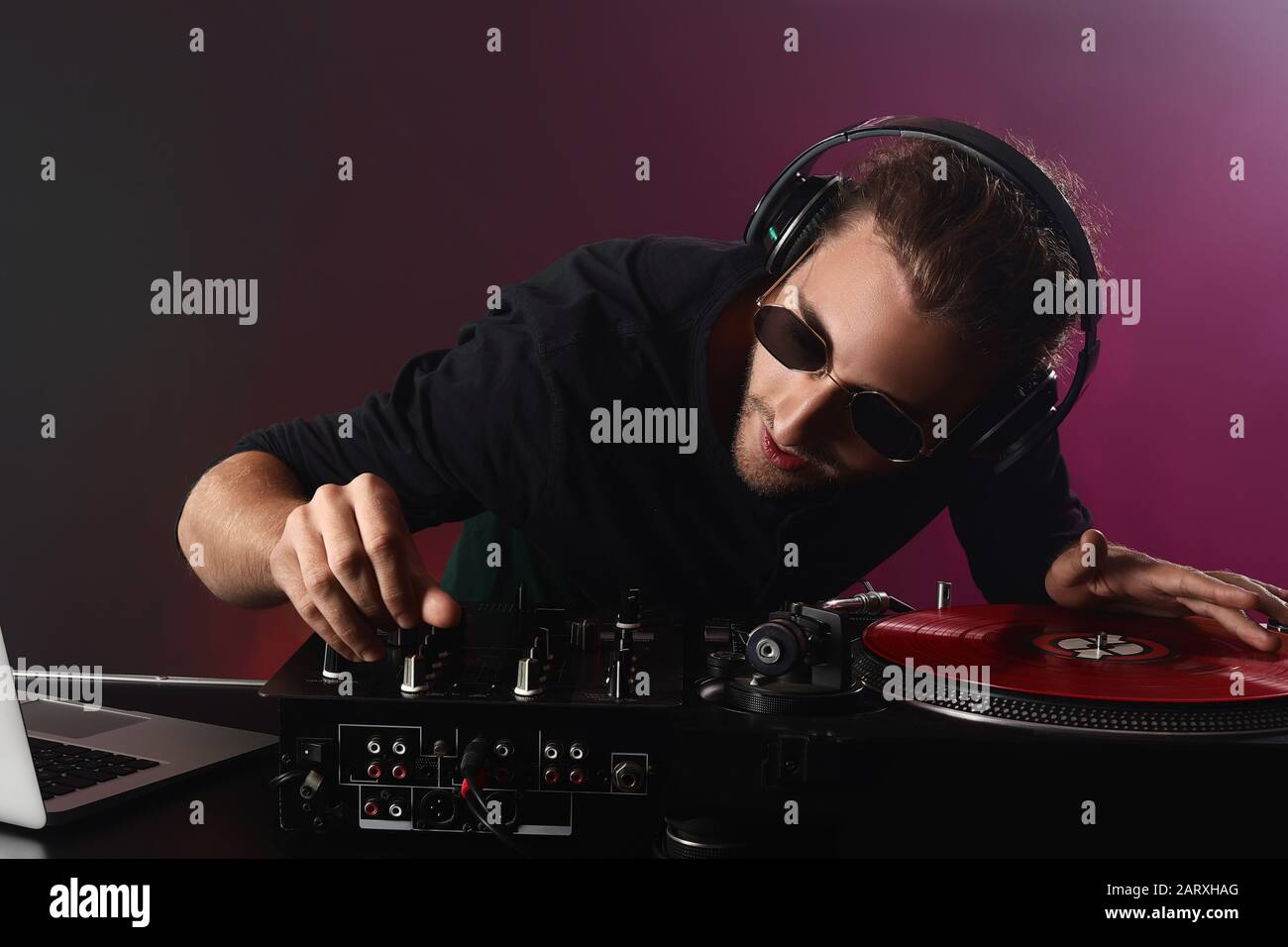 Male dj playing music in nightclub Stock Photo - Alamy