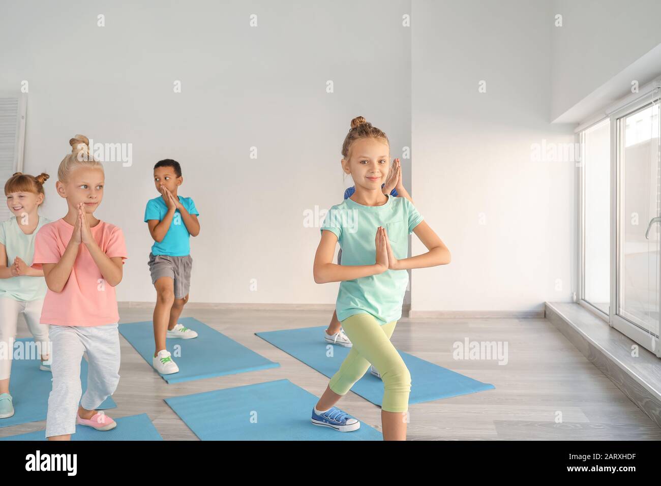 Afro kid stretching exercise hi-res stock photography and images - Alamy