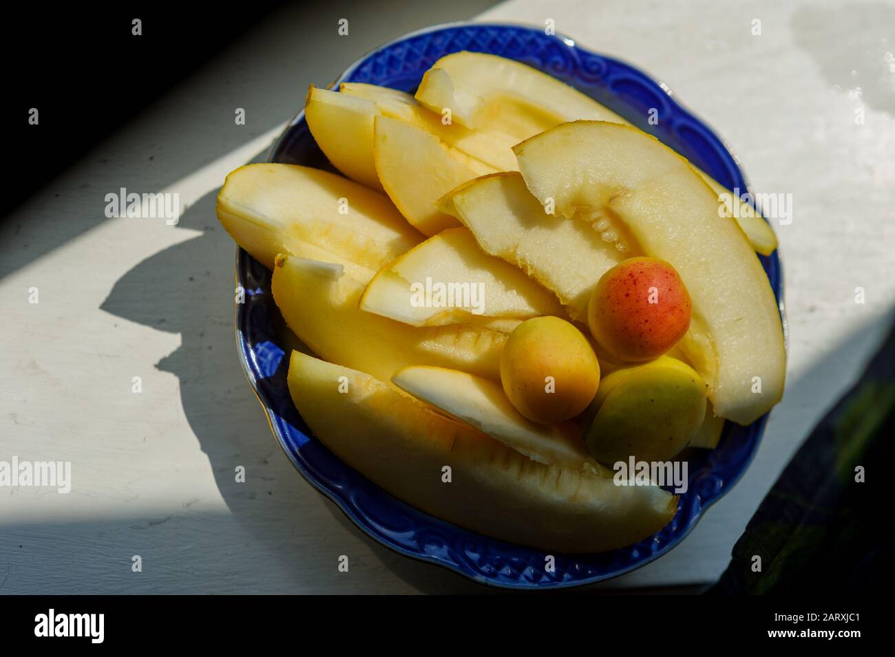 Melon's slices with fresh peach. Melon slices and apricot Stock Photo ...