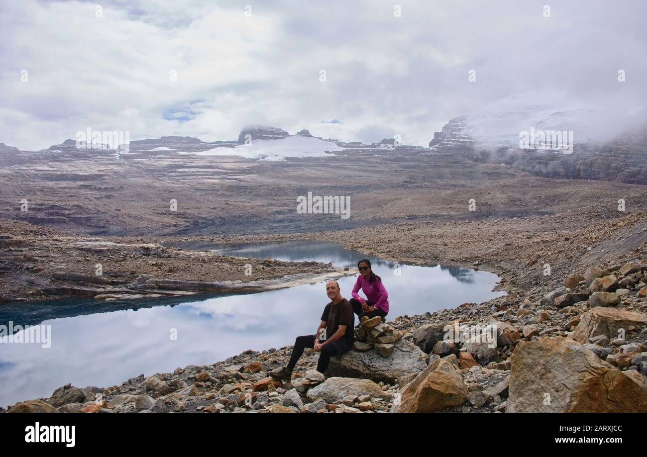 Pan de Azucar and Pulpito Del Diablo reflected in high altitude tarn ...