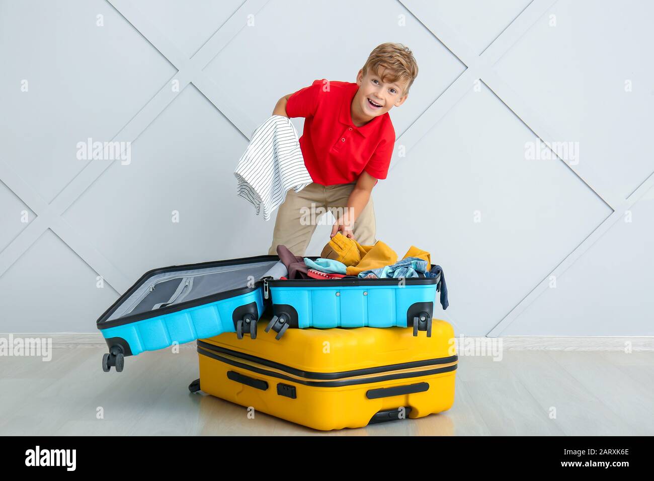 Kid Packing Suitcase