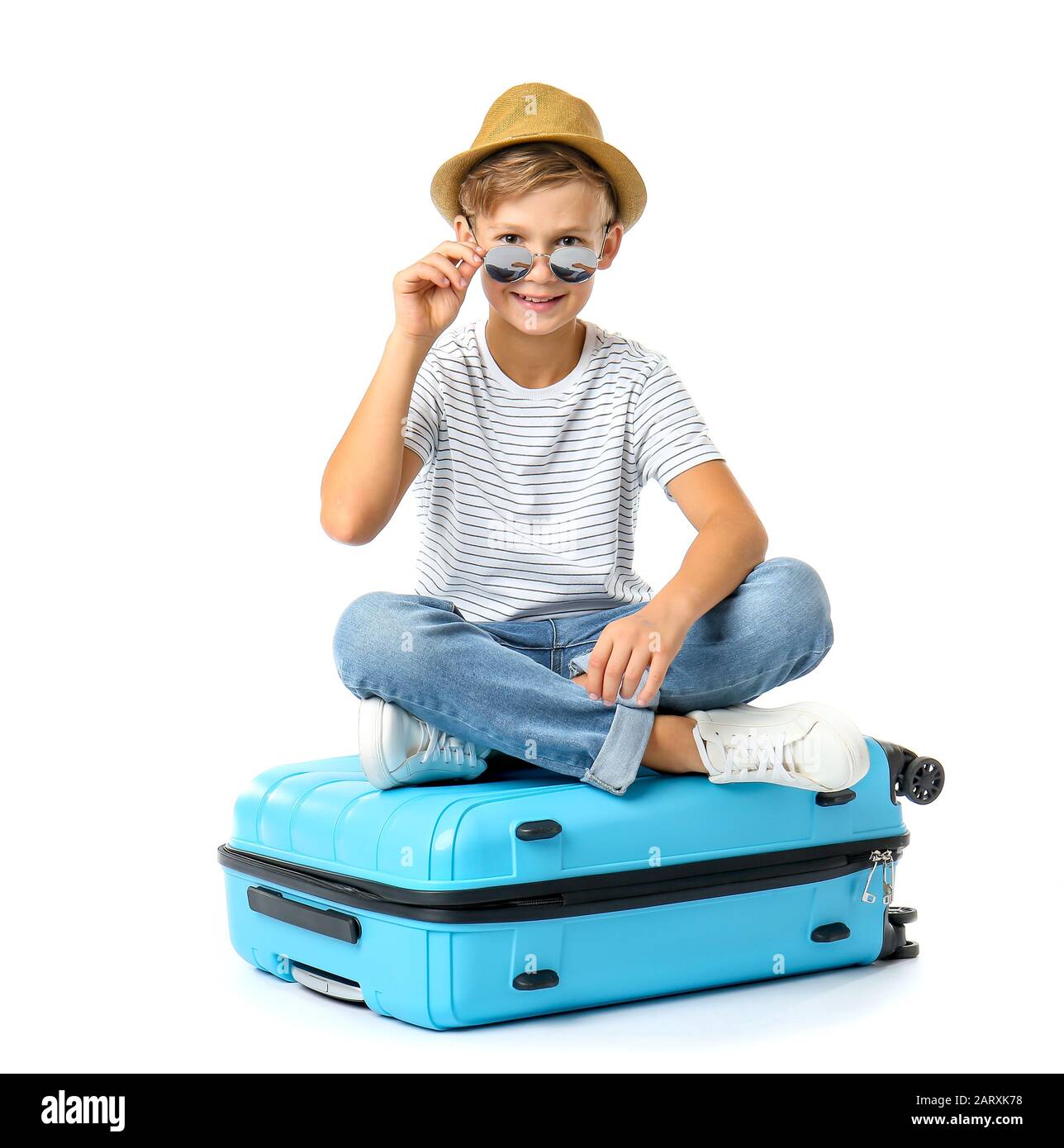 Cute little boy with suitcase on white background Stock Photo - Alamy