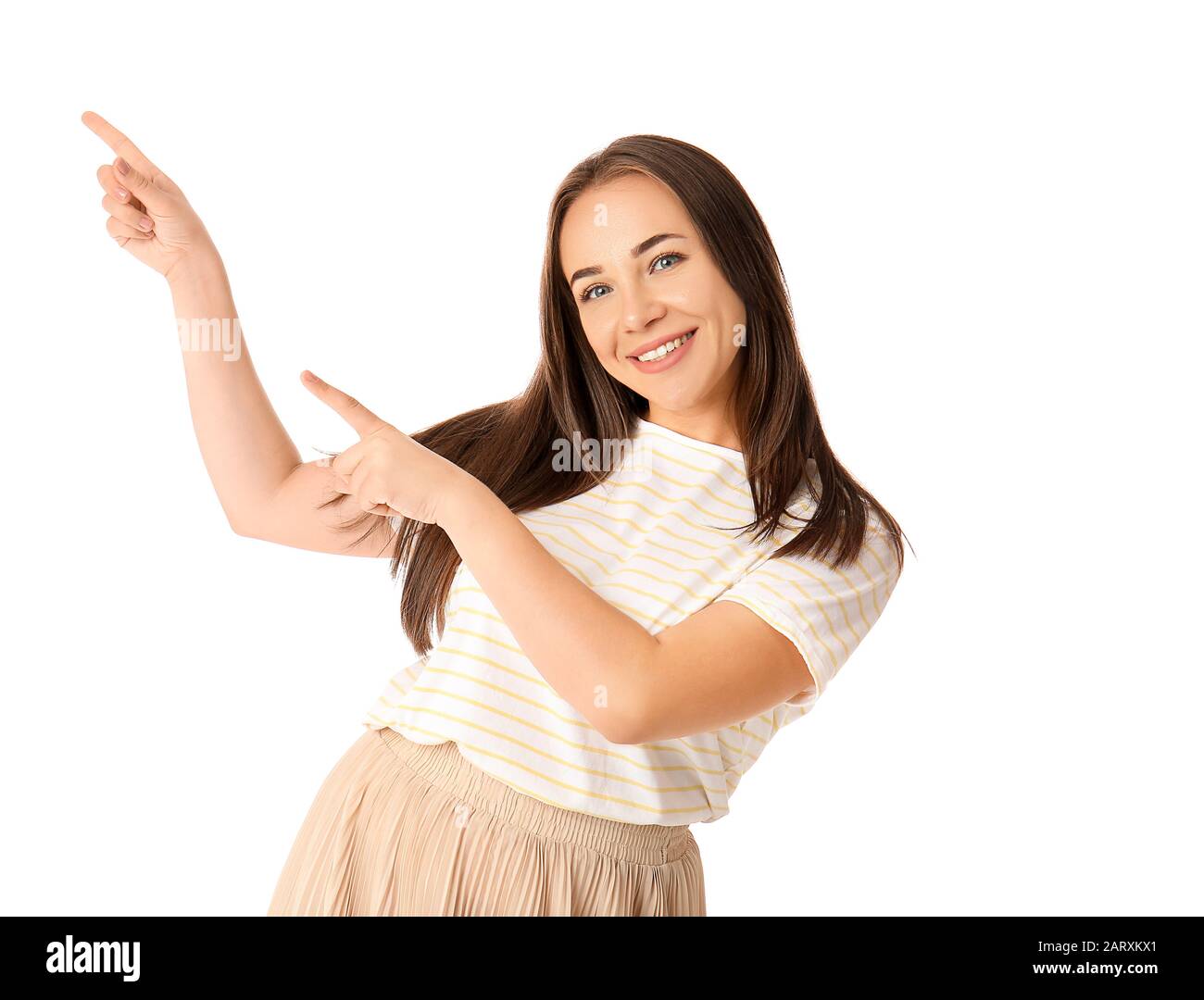 Portrait of beautiful woman showing something on white background Stock ...