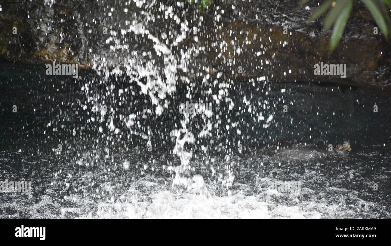 Water falling through rock hi-res stock photography and images - Alamy