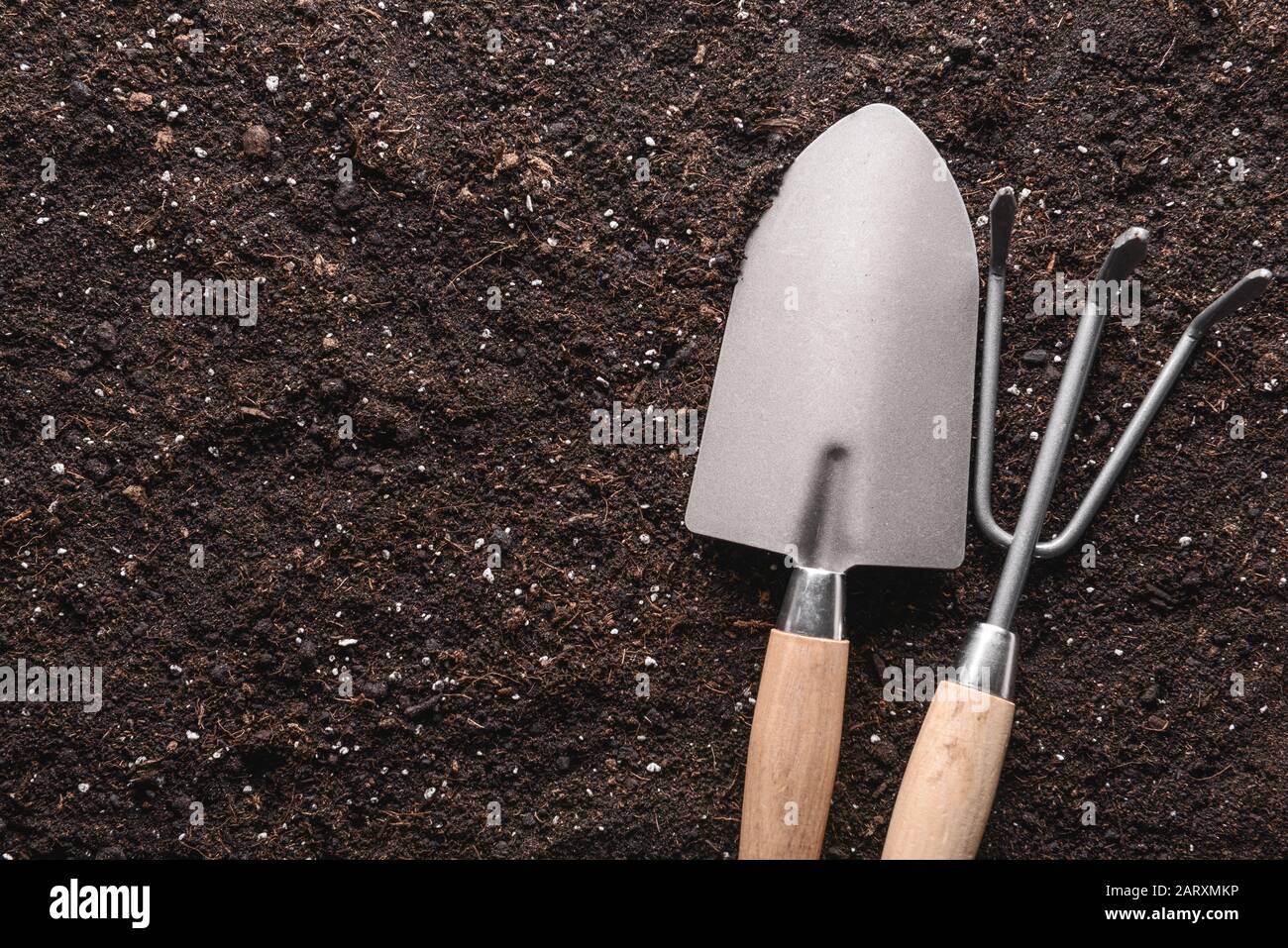 Gardening tools on soil, top view Stock Photo - Alamy