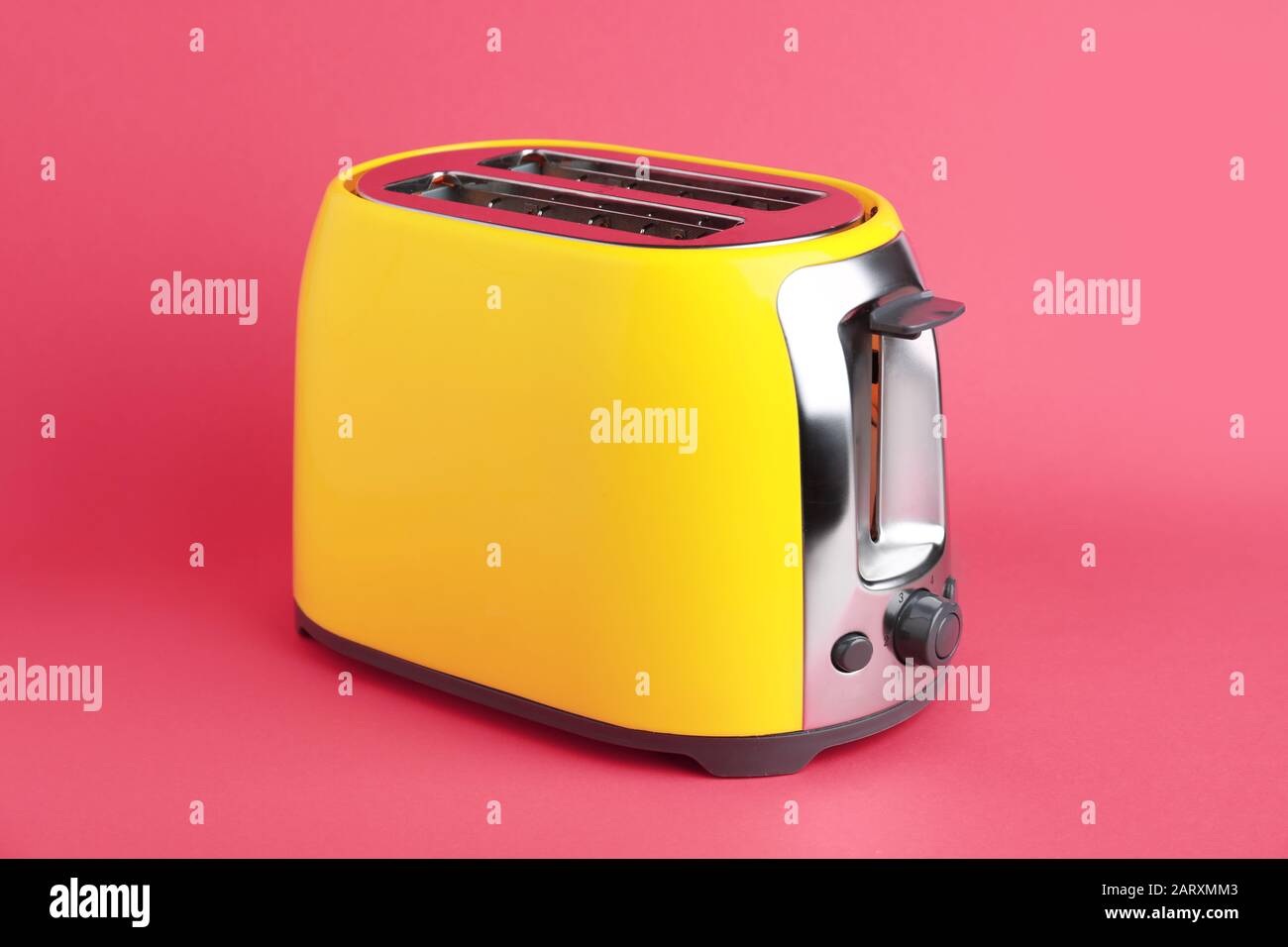 Modern toaster on color background Stock Photo - Alamy