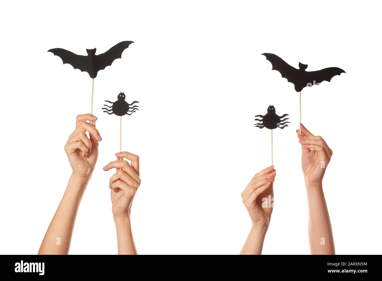 Many hands with Halloween decor on white background Stock Photo - Alamy