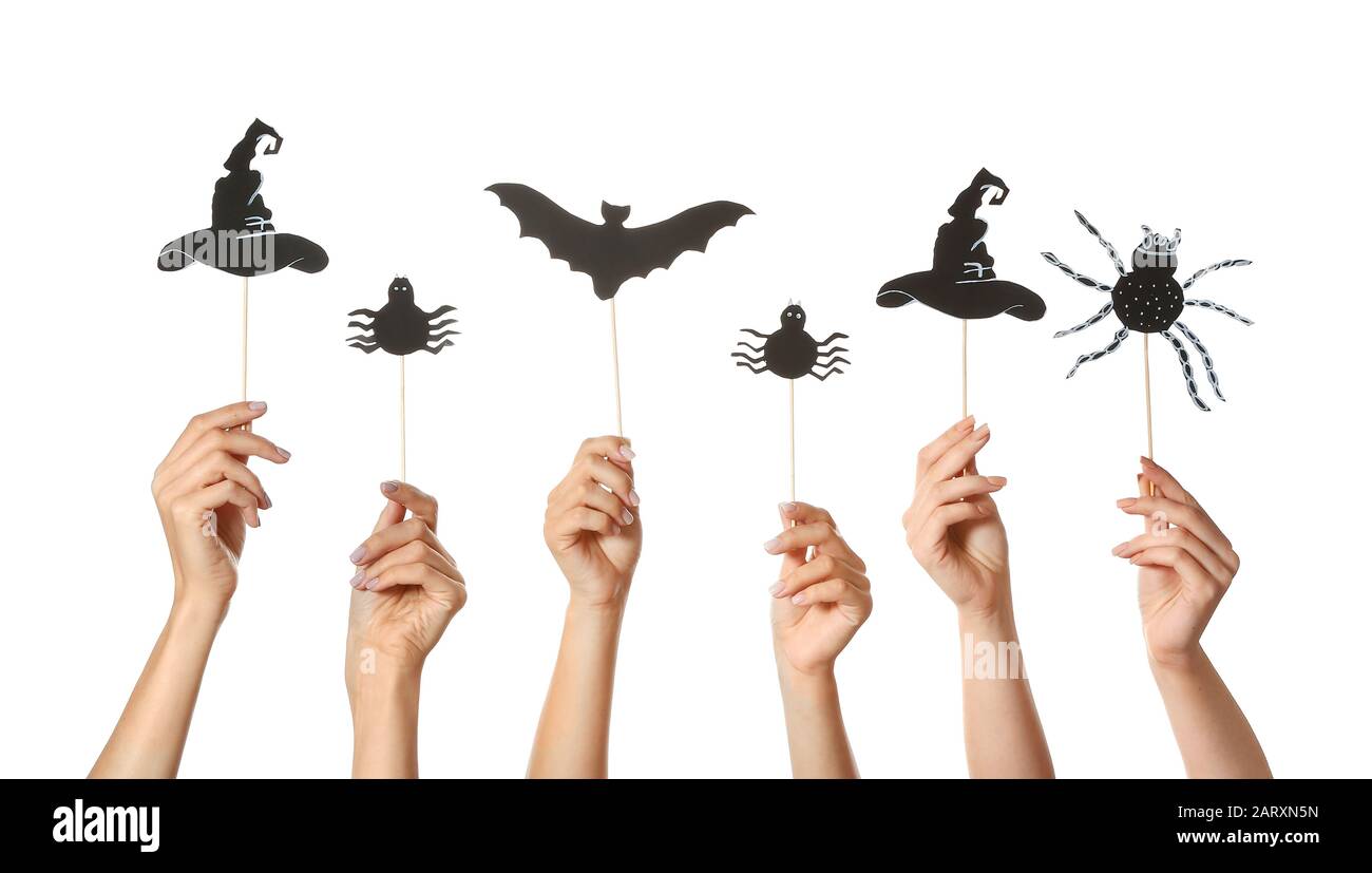 Many hands with Halloween decor on white background Stock Photo - Alamy