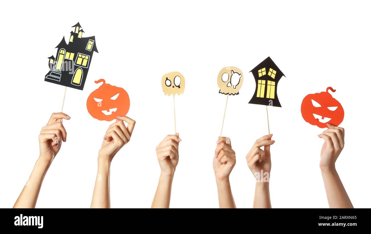 Many hands with Halloween decor on white background Stock Photo - Alamy