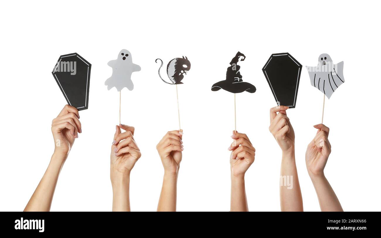 Many hands with Halloween decor on white background Stock Photo - Alamy