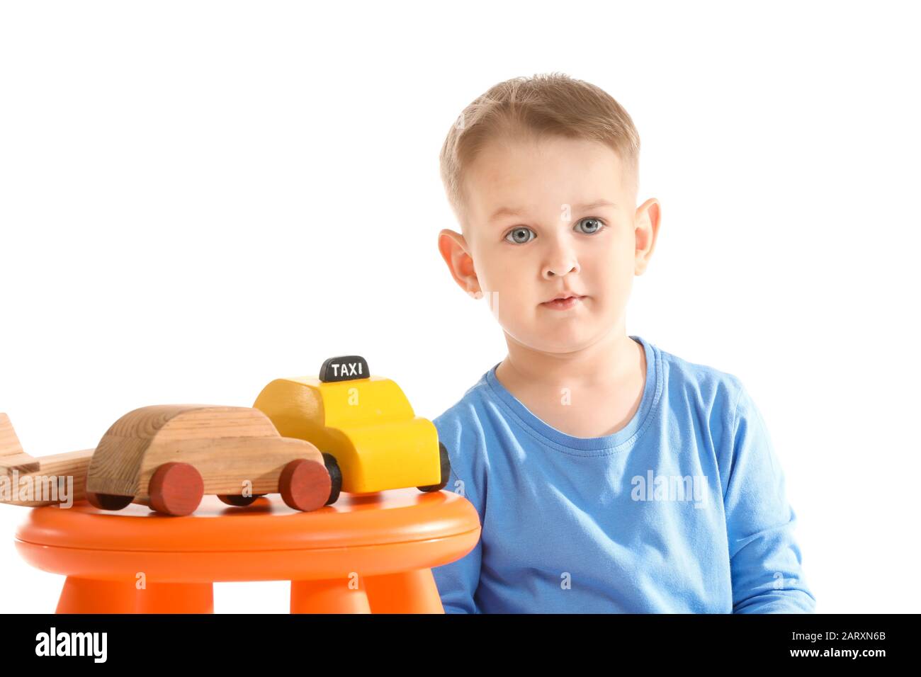 Portrait of cute little boy with toys on white background Stock Photo ...
