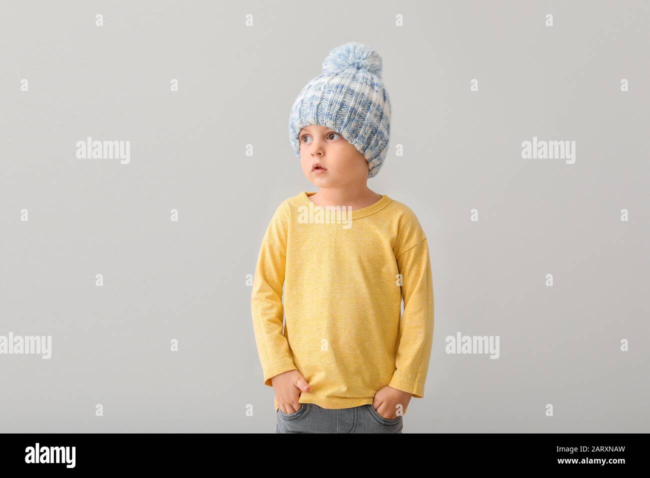 Portrait of cute little boy on light background Stock Photo - Alamy